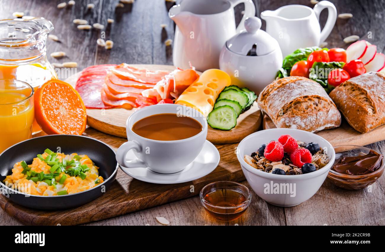 Breakfast served with coffee, scrambled eggs, cereals and ham Stock ...