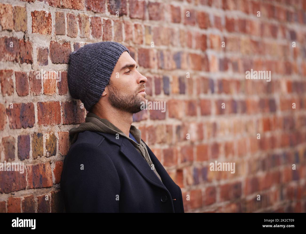 Man leaning against wall hi-res stock photography and images - Alamy