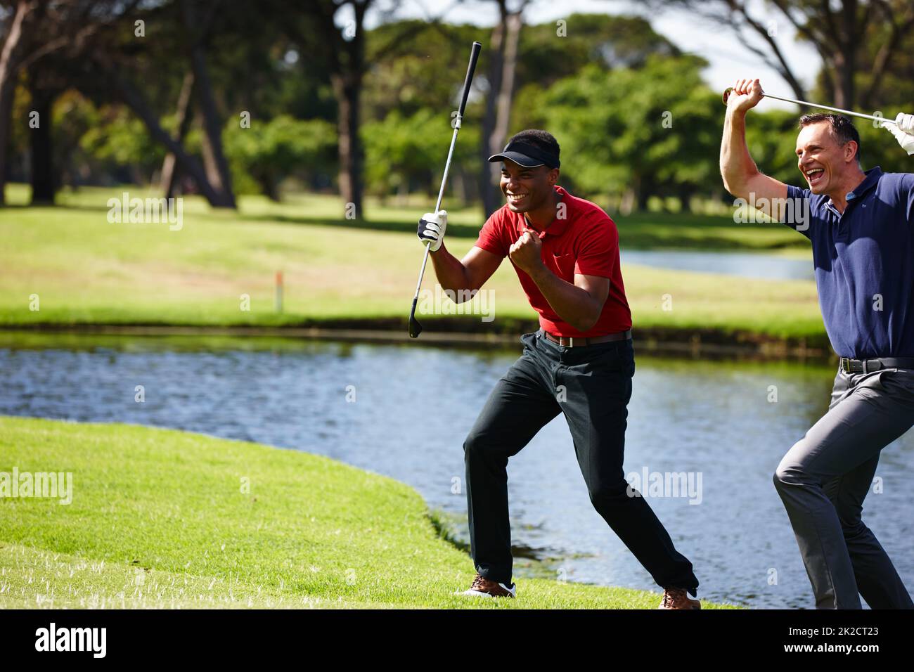 That one in a million shot. Shot of two golfers celebrating a great ...