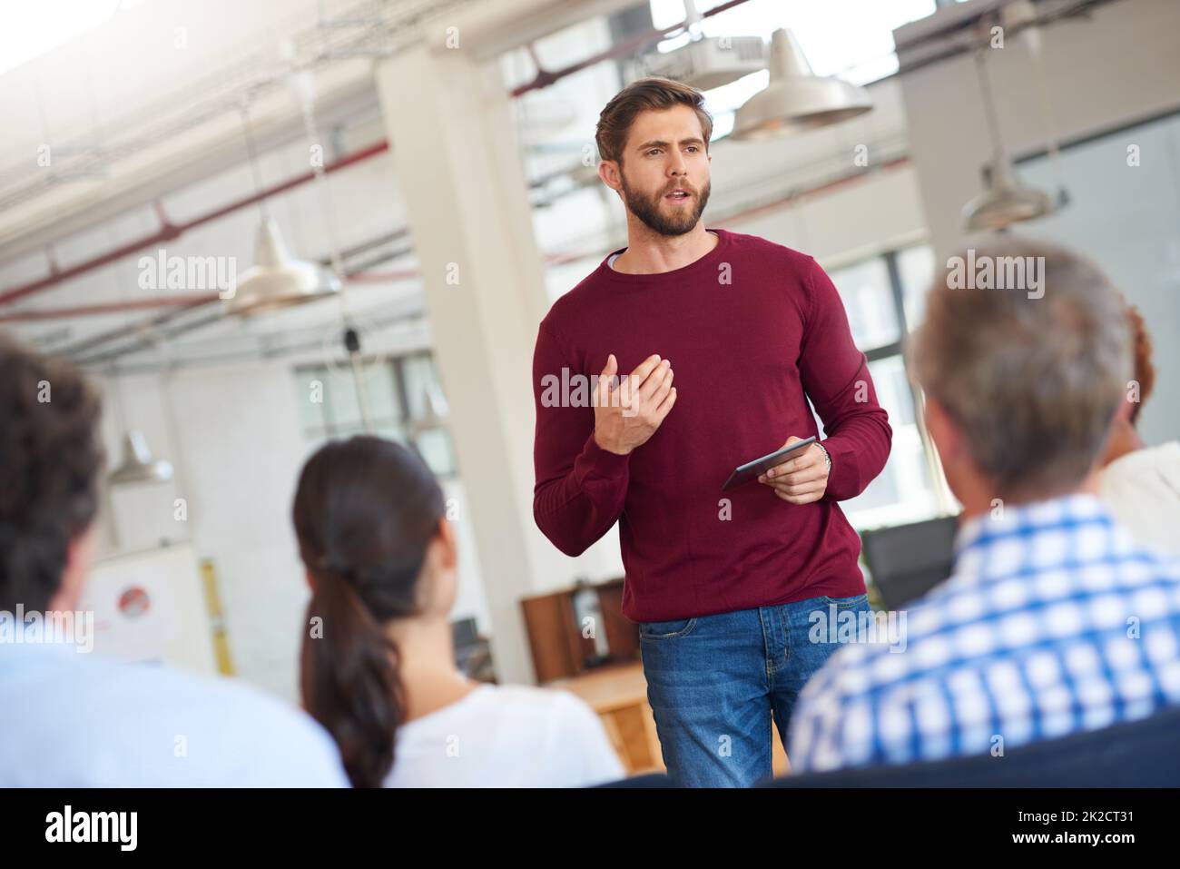 Speak with confidence. Shot of designer giving a presentation to his ...