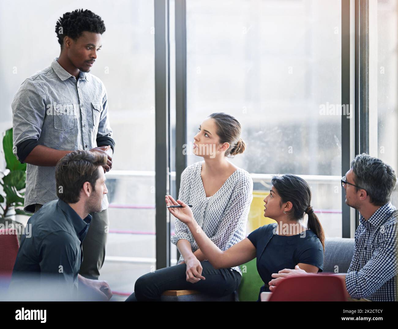 Everyones input makes a difference. a group of coworkers in a meeting ...