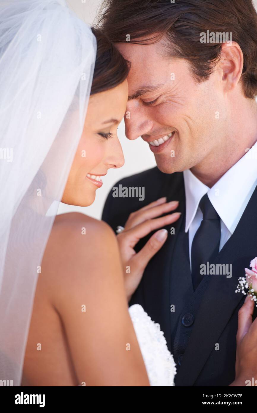 Taking a moment to reflect on their love. A happy newlywed couple ...