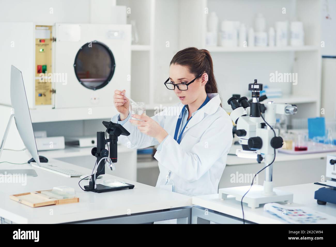 Scientist mixing chemicals hi-res stock photography and images - Alamy
