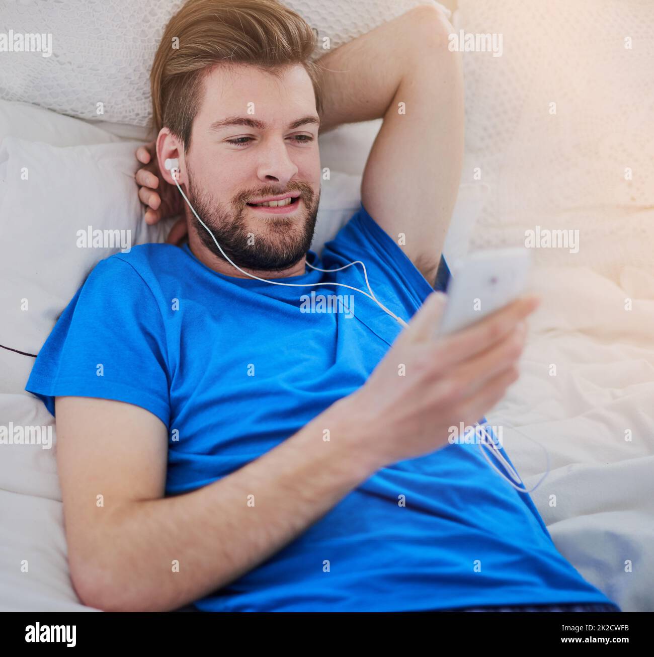 Man listening music lying on hi-res stock photography and images - Alamy