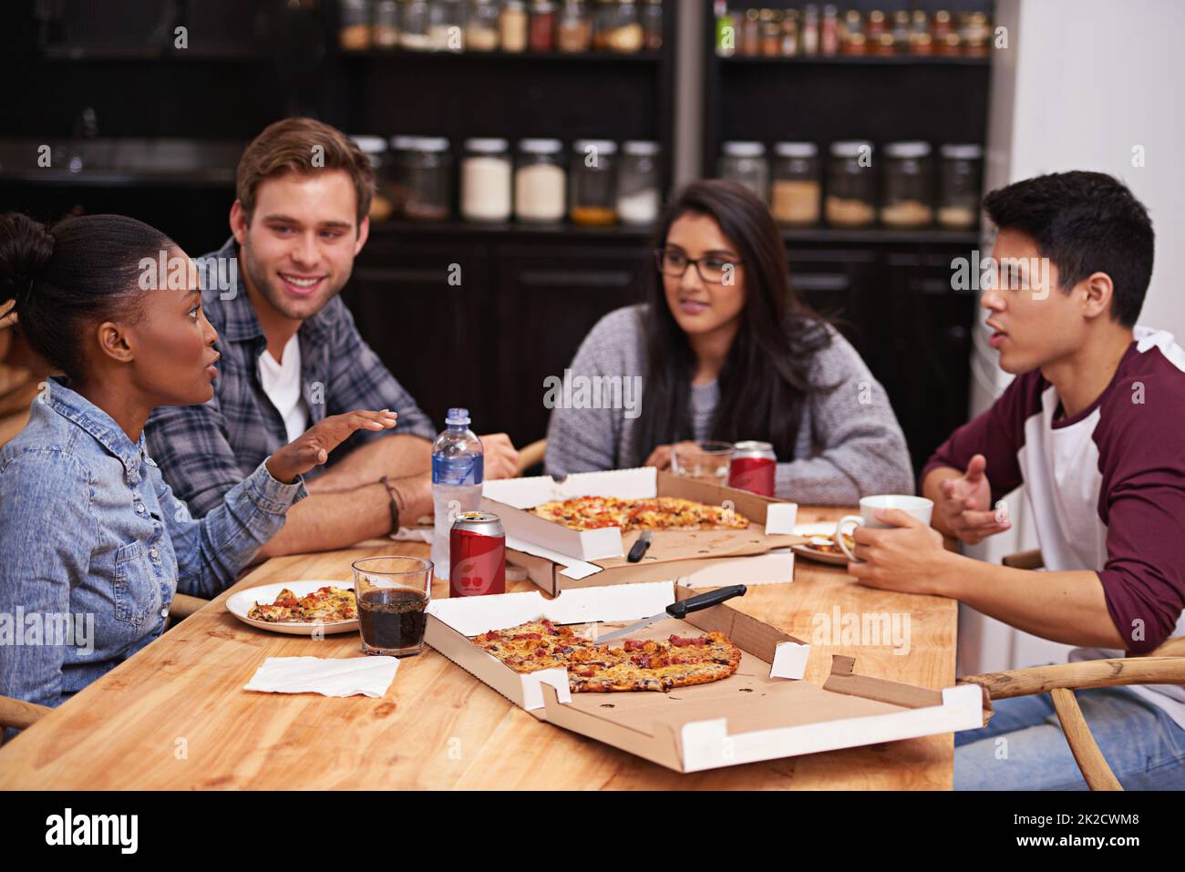 Table people pizza hi-res stock photography and images - Alamy