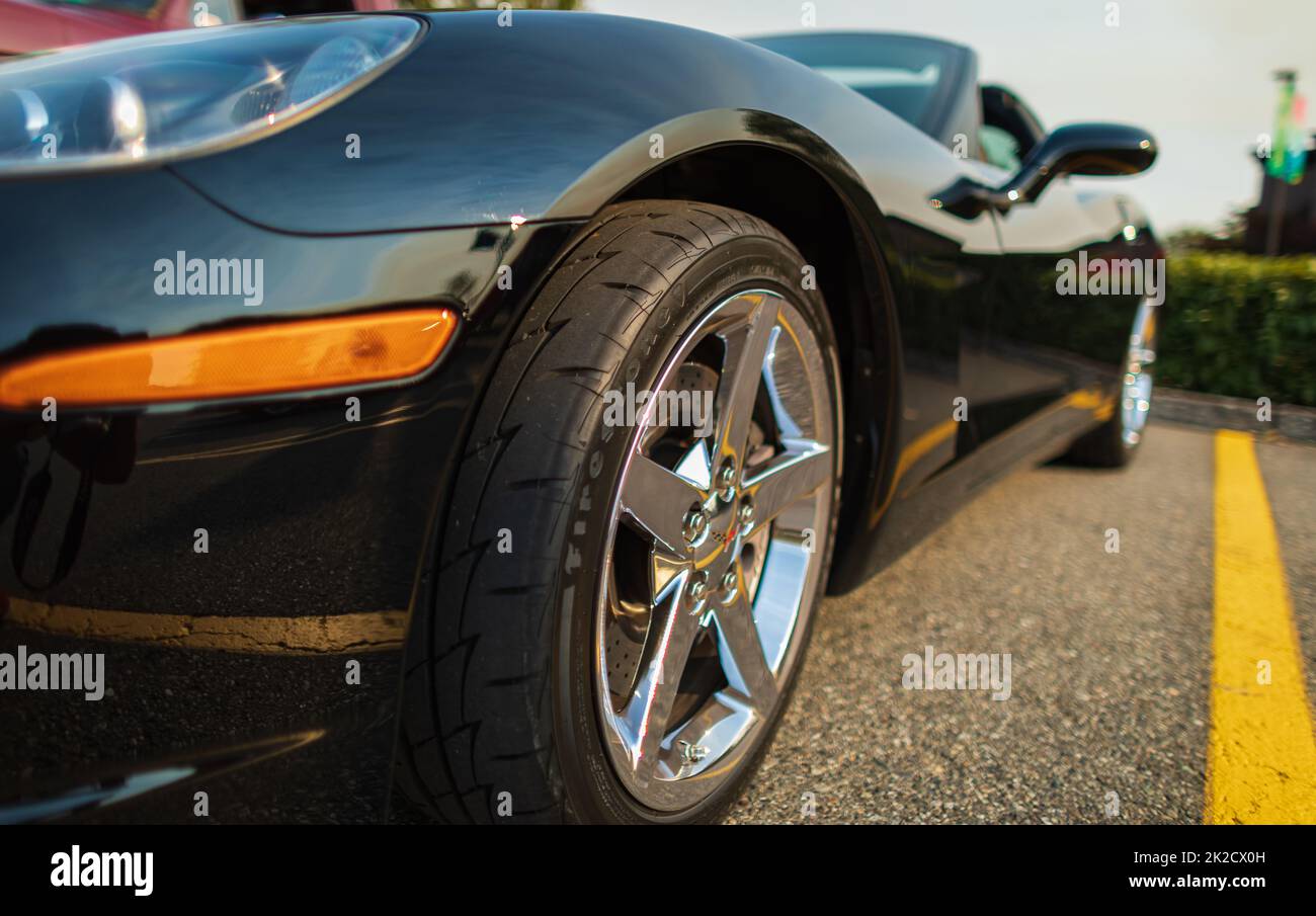 Wing, wheel and car headlight black, close-up. Detail on one of the LED ...