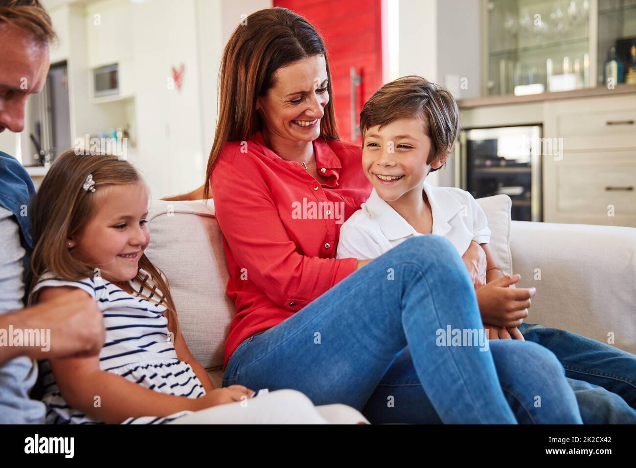 Parents sitting on couch hi-res stock photography and images - Alamy