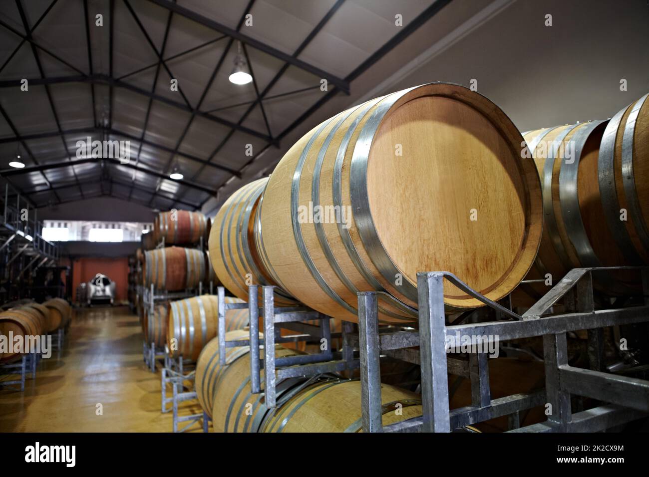The factory floor. Wine barrels inside a factory Stock Photo - Alamy