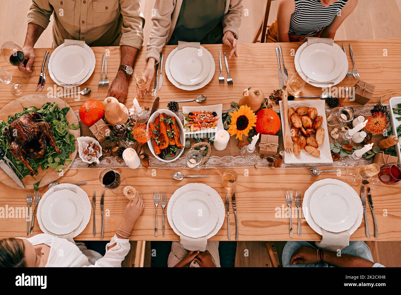 Gather around the table, its time to give thanks. High angle shot of a ...