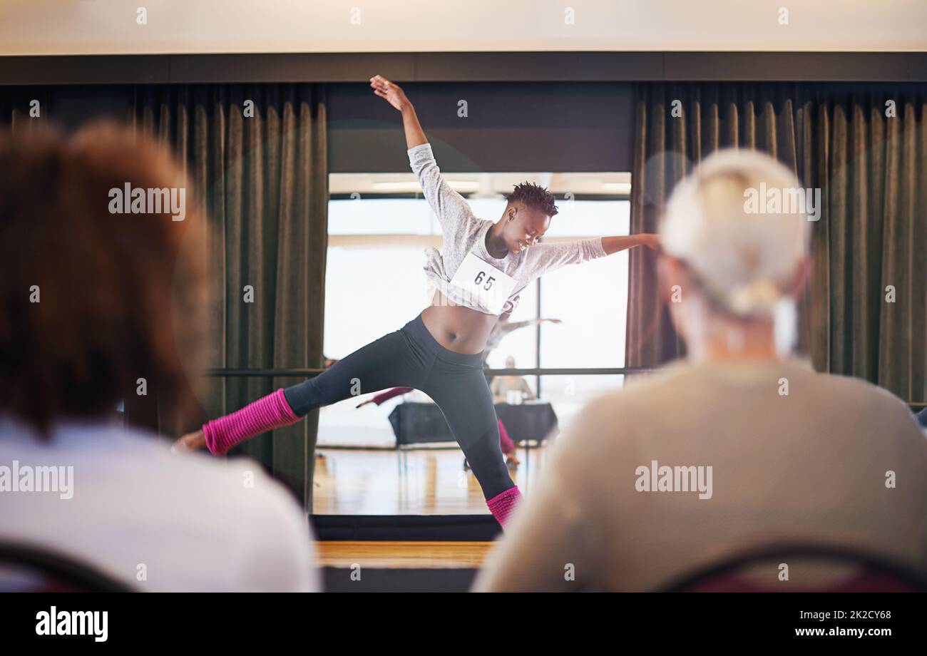 Moving to the music. Shot of a female dancer performing before the ...