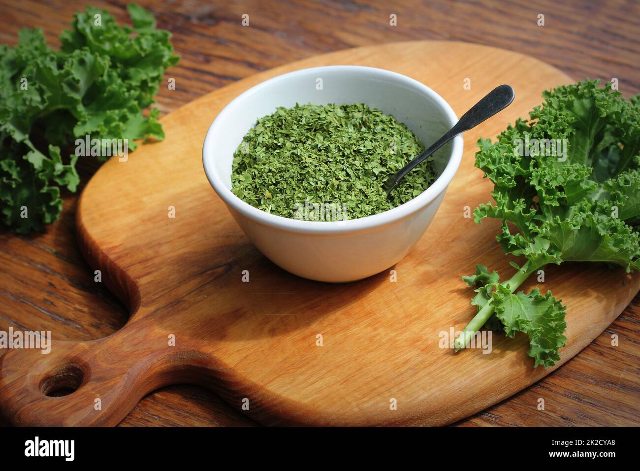 Chopped dry kale leaves on rustic background Stock Photo - Alamy