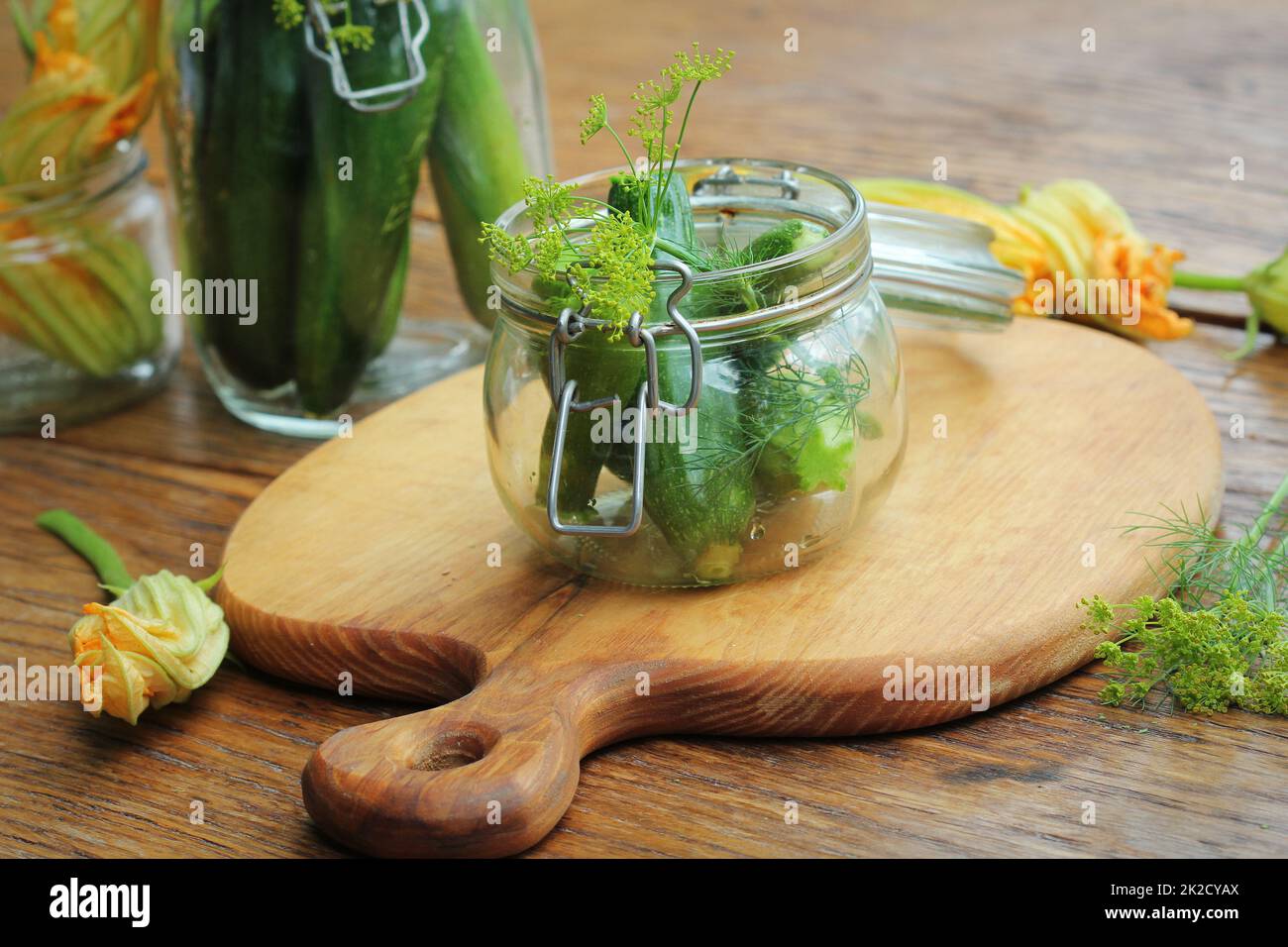 Zucchini preserve in glass jar on a wooden table. Homemade canning ...