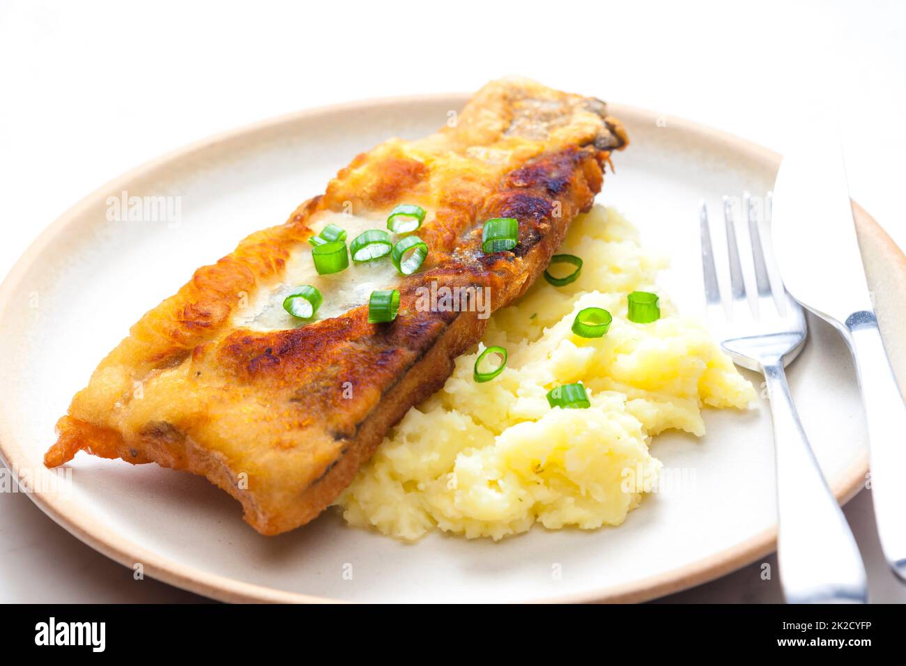 fried fish with mashed potatoes and spring onion Stock Photo - Alamy