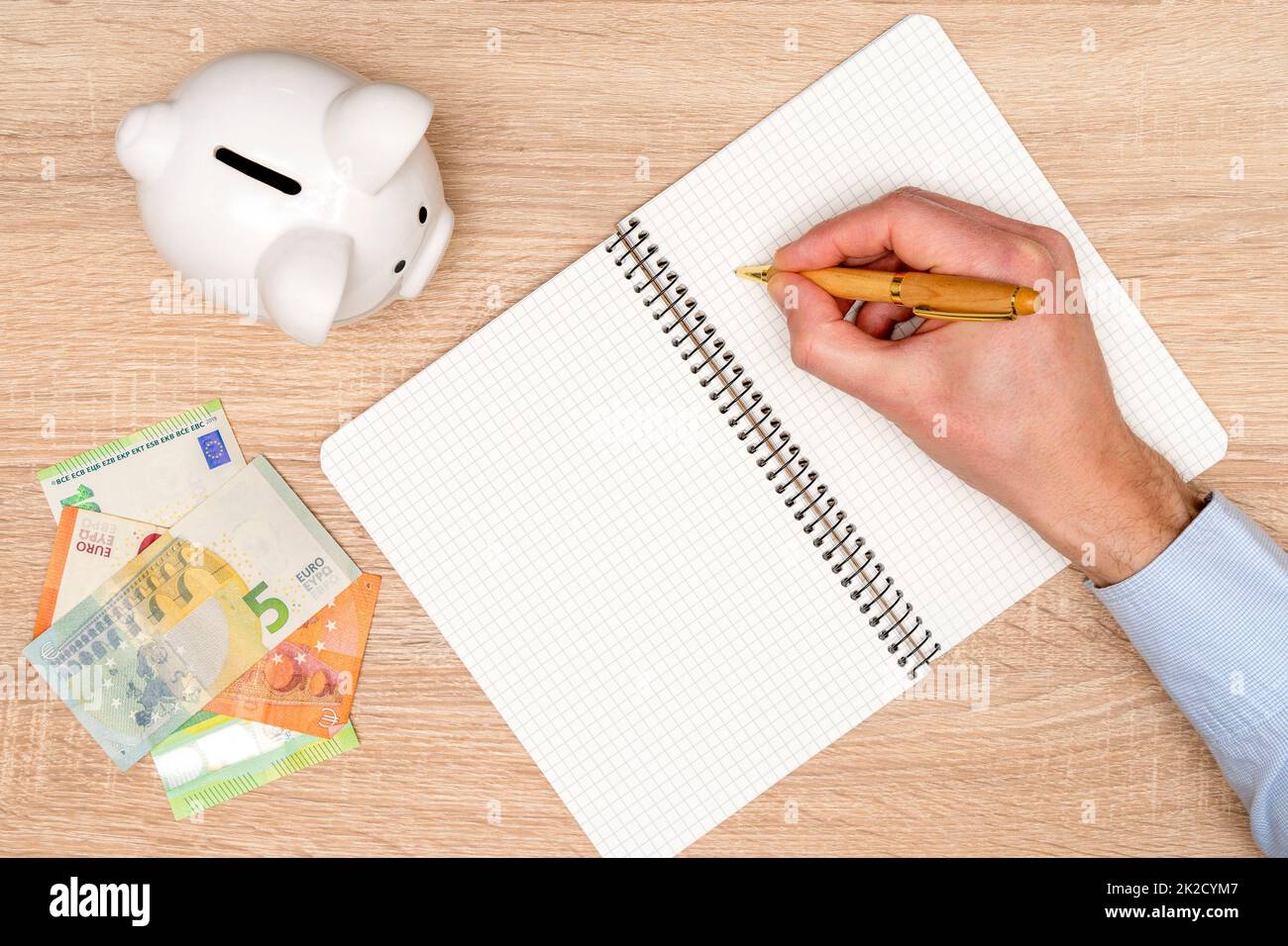 Writing notes or planning schedule on blank spiral notebook Stock Photo ...