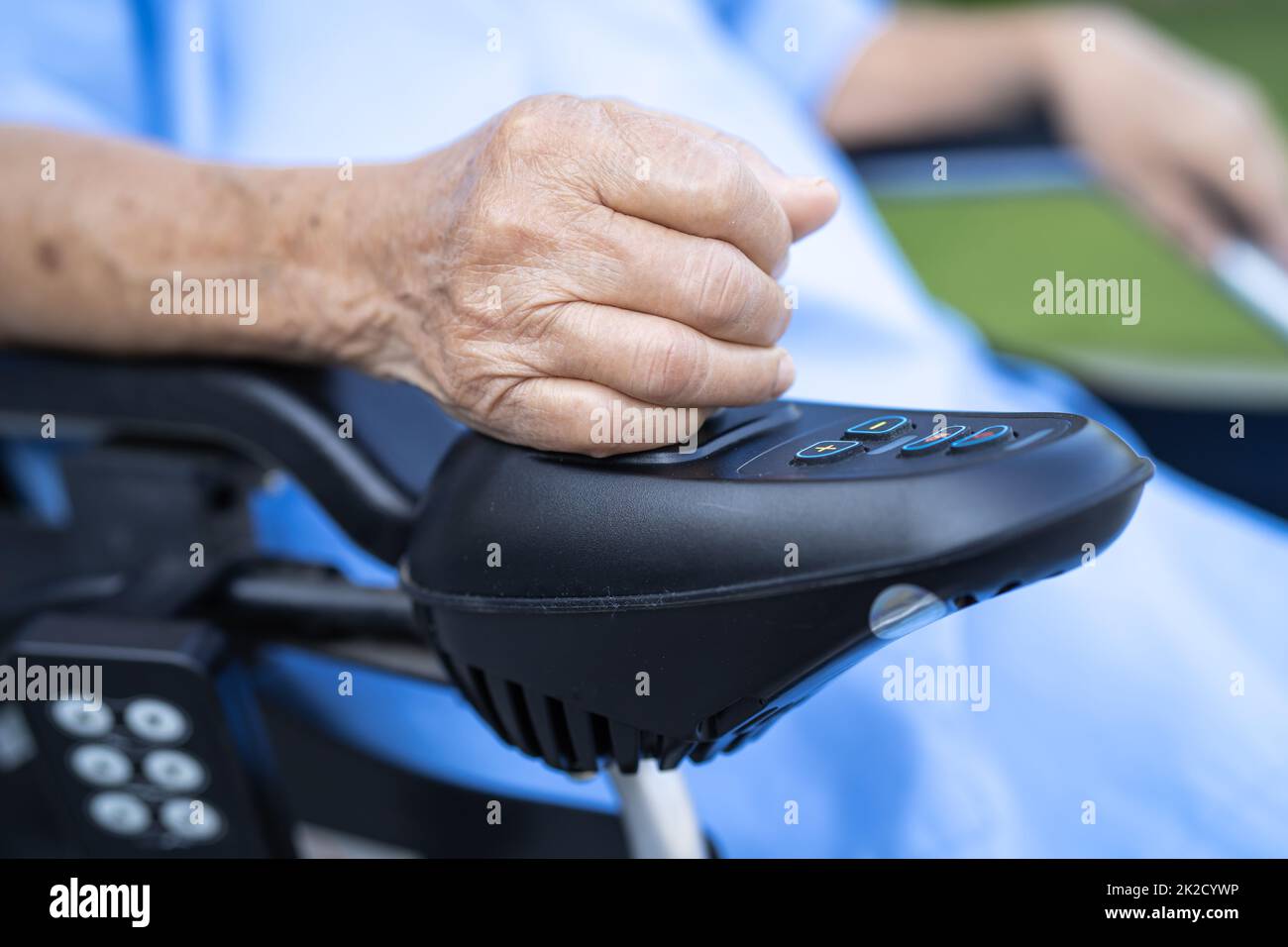 Asian senior or elderly old lady woman patient on electric wheelchair ...