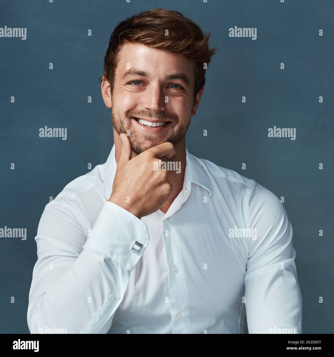 Hes got charm and confidence. Studio portrait of a handsome young man ...