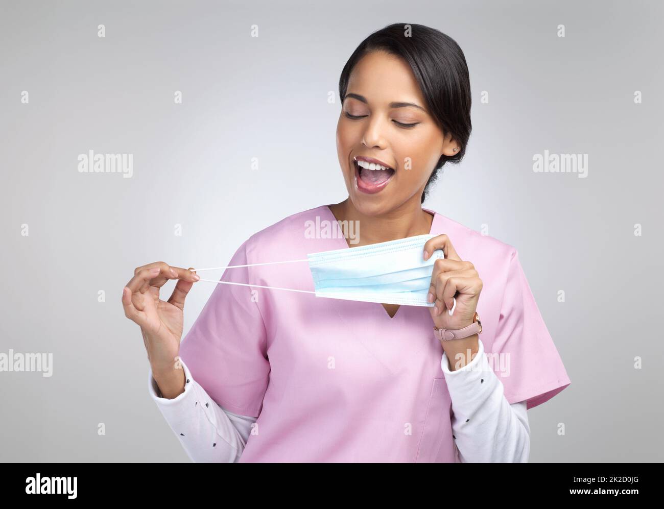 Over the ear and youre good to go. Cropped shot of an attractive young ...