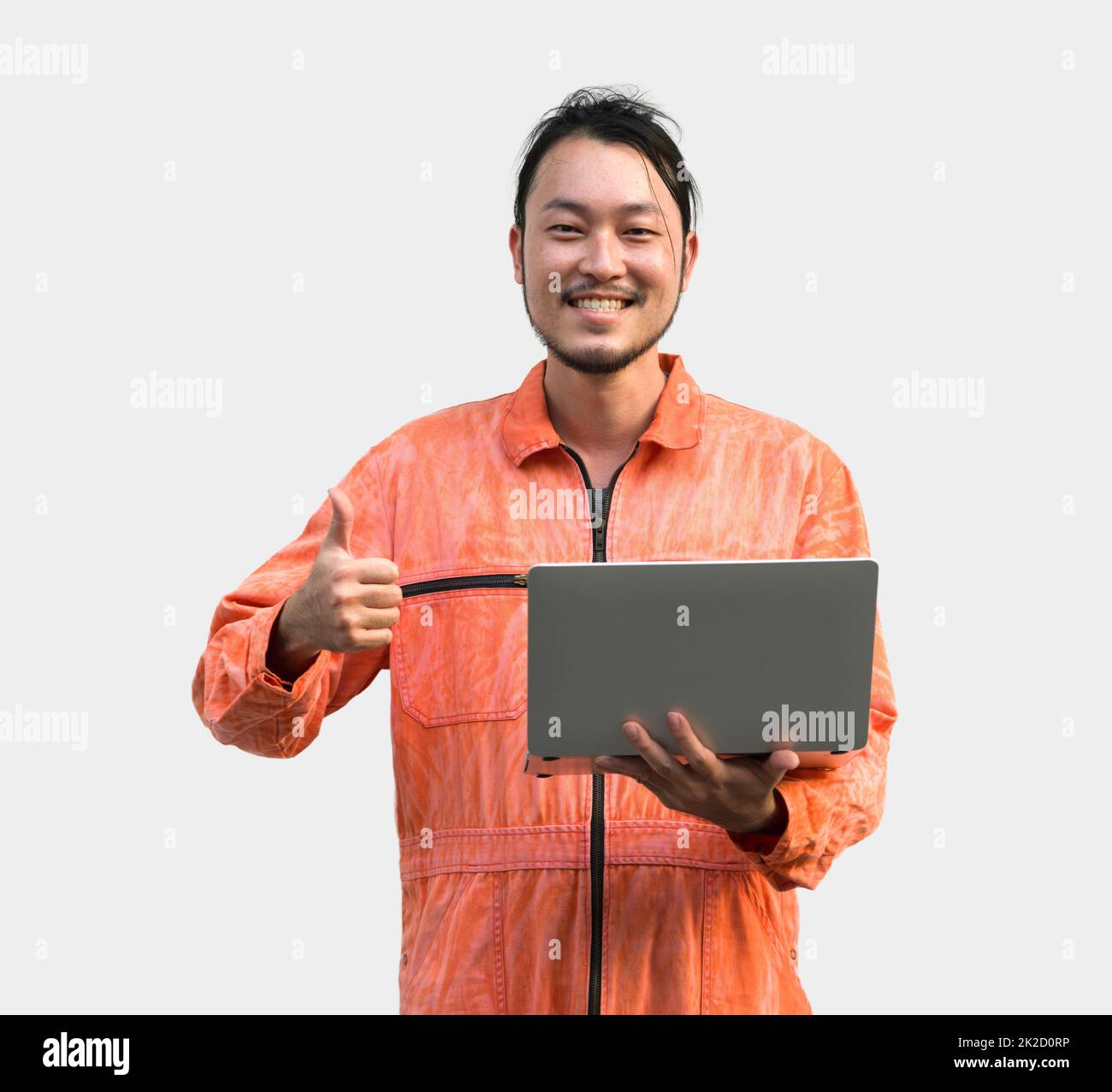 The chief mechanic in an orange uniform holding laptop computer ...