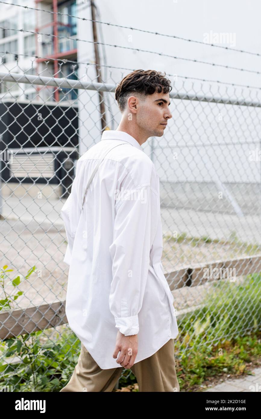 Young man walking on white hi-res stock photography and images - Alamy