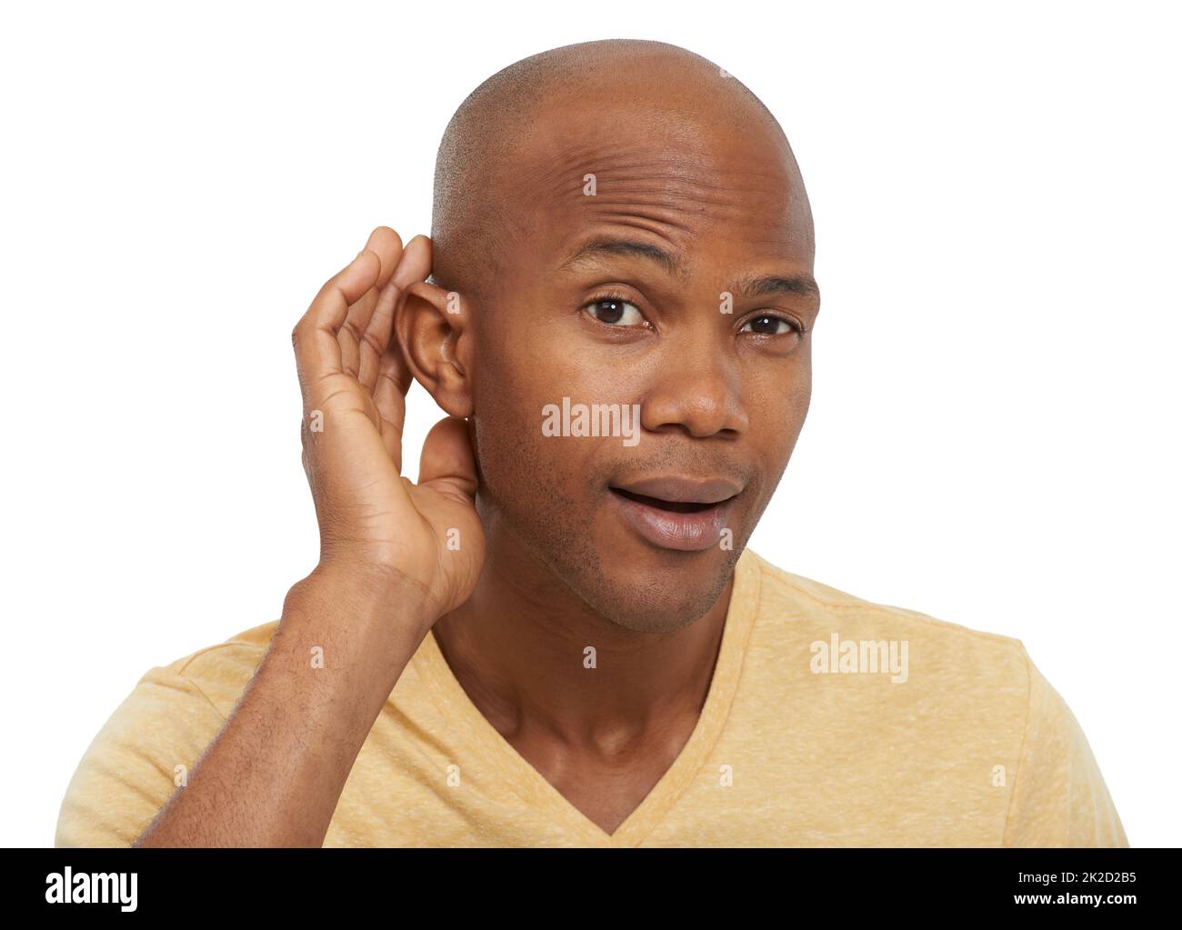 Say again. A young ethnic man holding his hand cupped against his ear ...