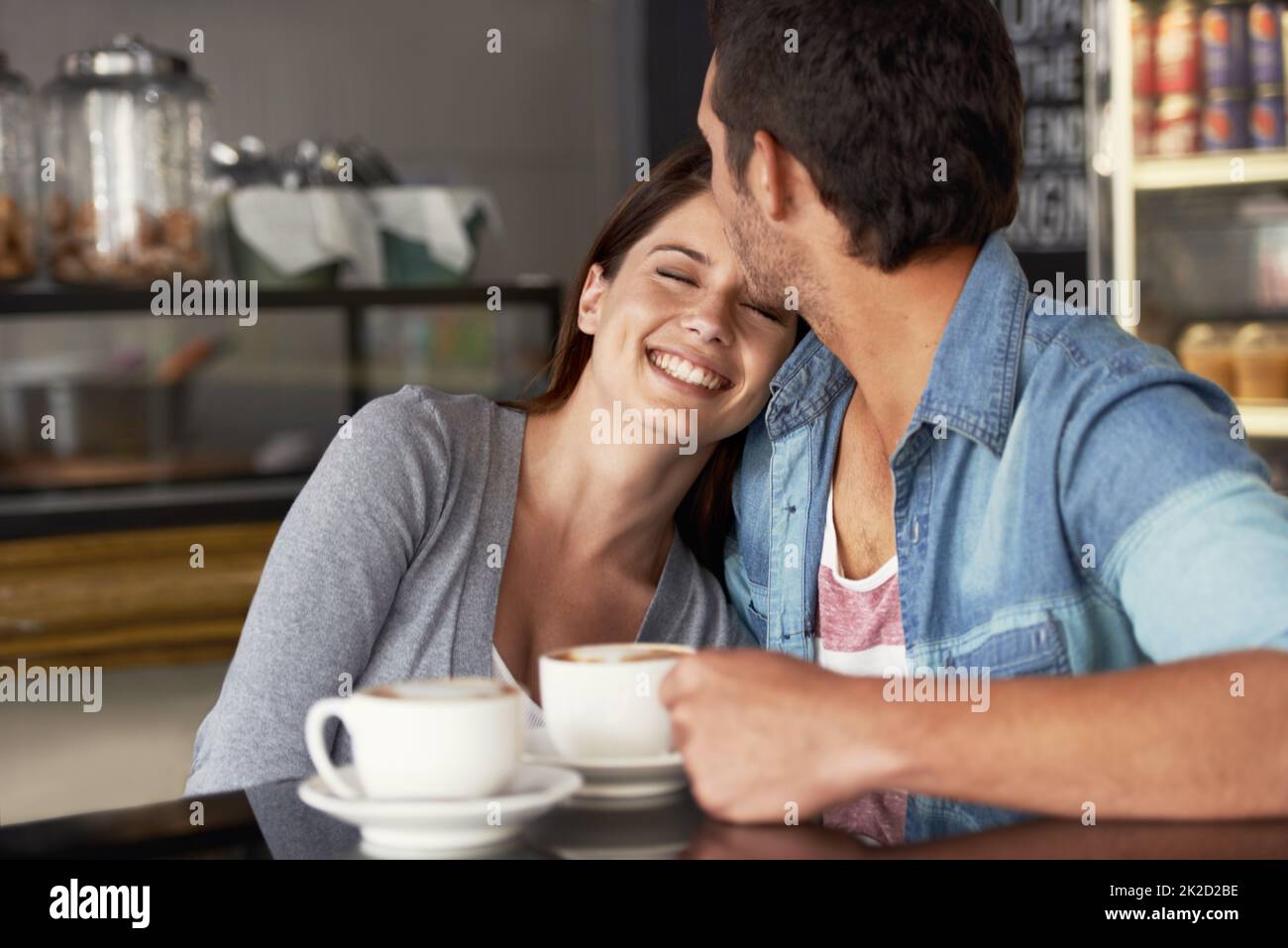 My boyfriend is amazing. Shot of a young couple talking together in a ...