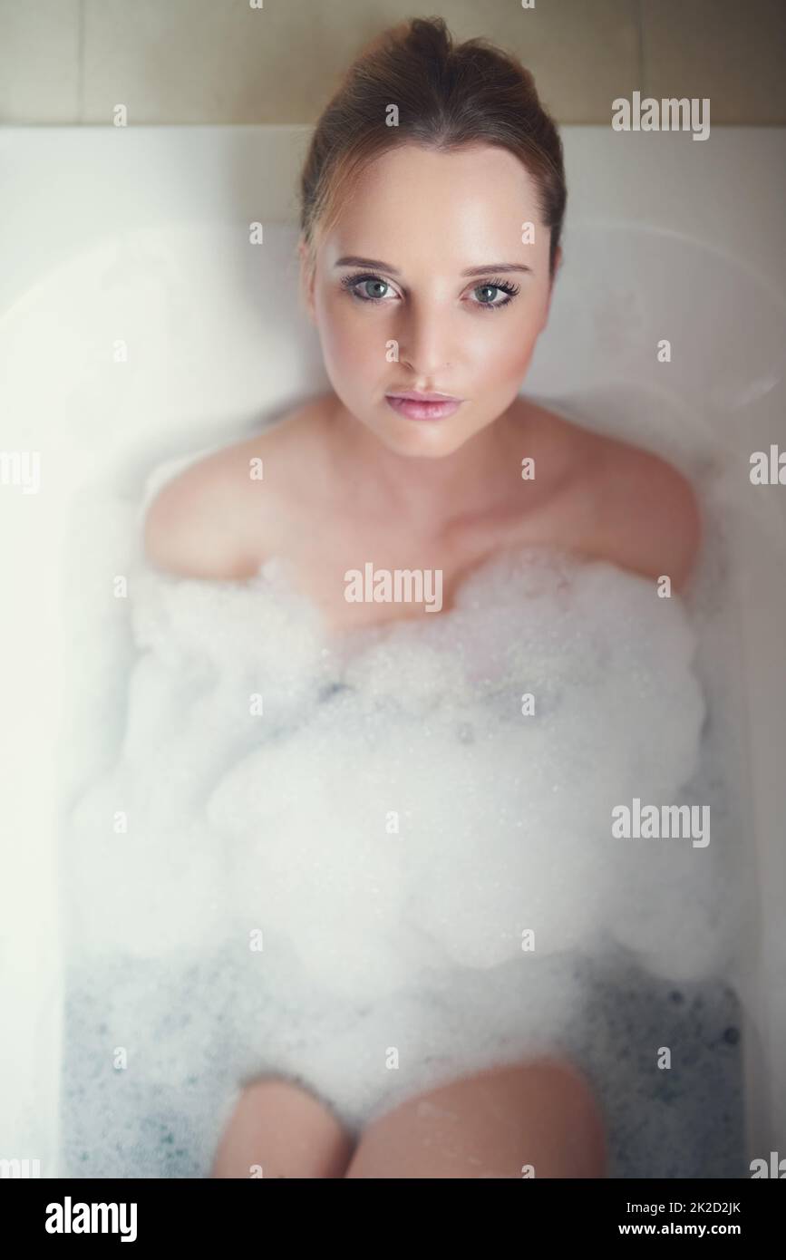Time To Unwind Portrait Of An Attractive Young Woman Relaxing In The