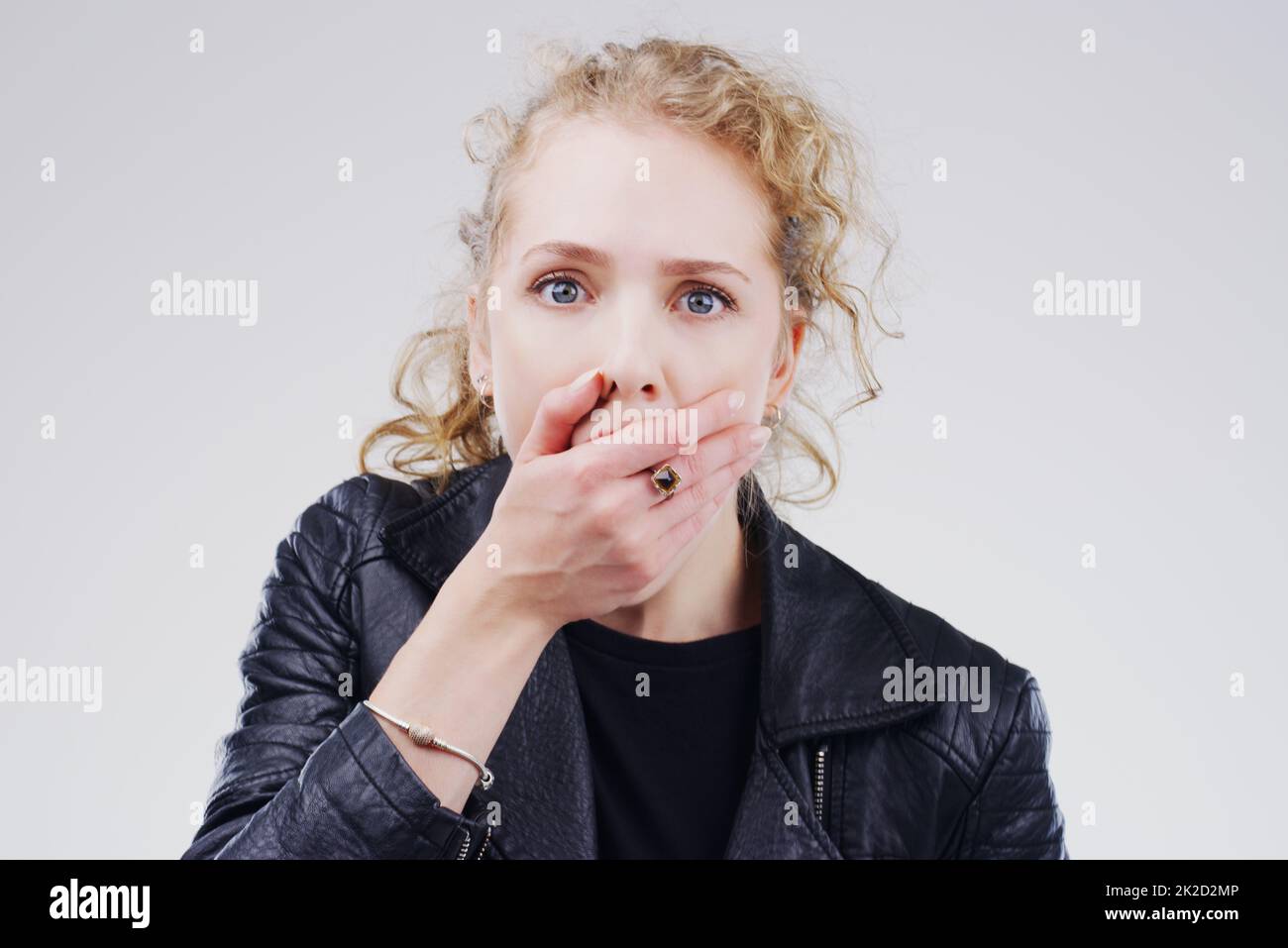 No way Tell me more. Studio shot of a young woman looking shocked ...