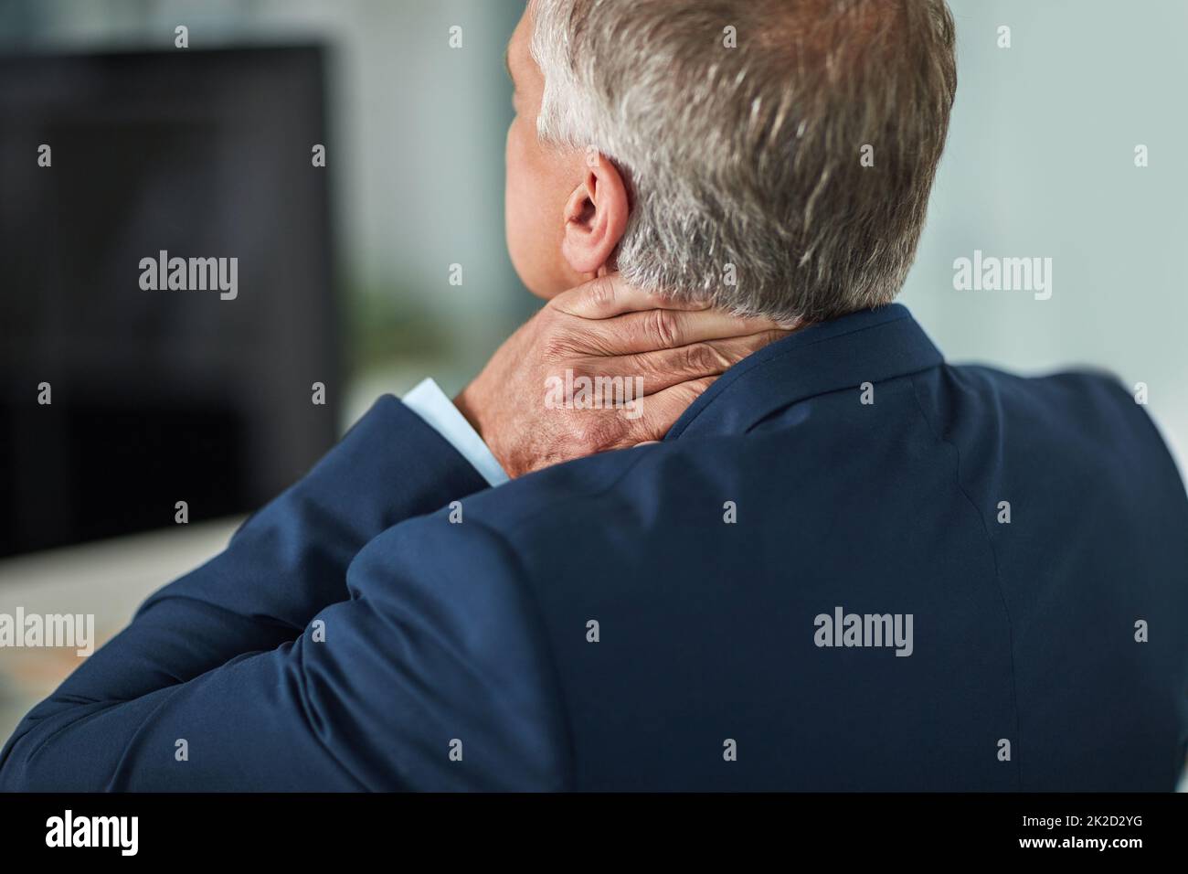 Man rubbing neck hi-res stock photography and images - Alamy
