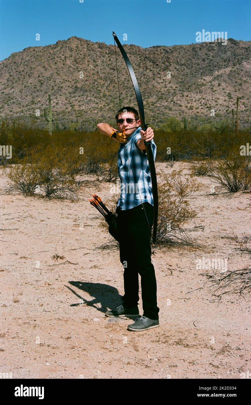 Child shooting arrow hi-res stock photography and images - Alamy