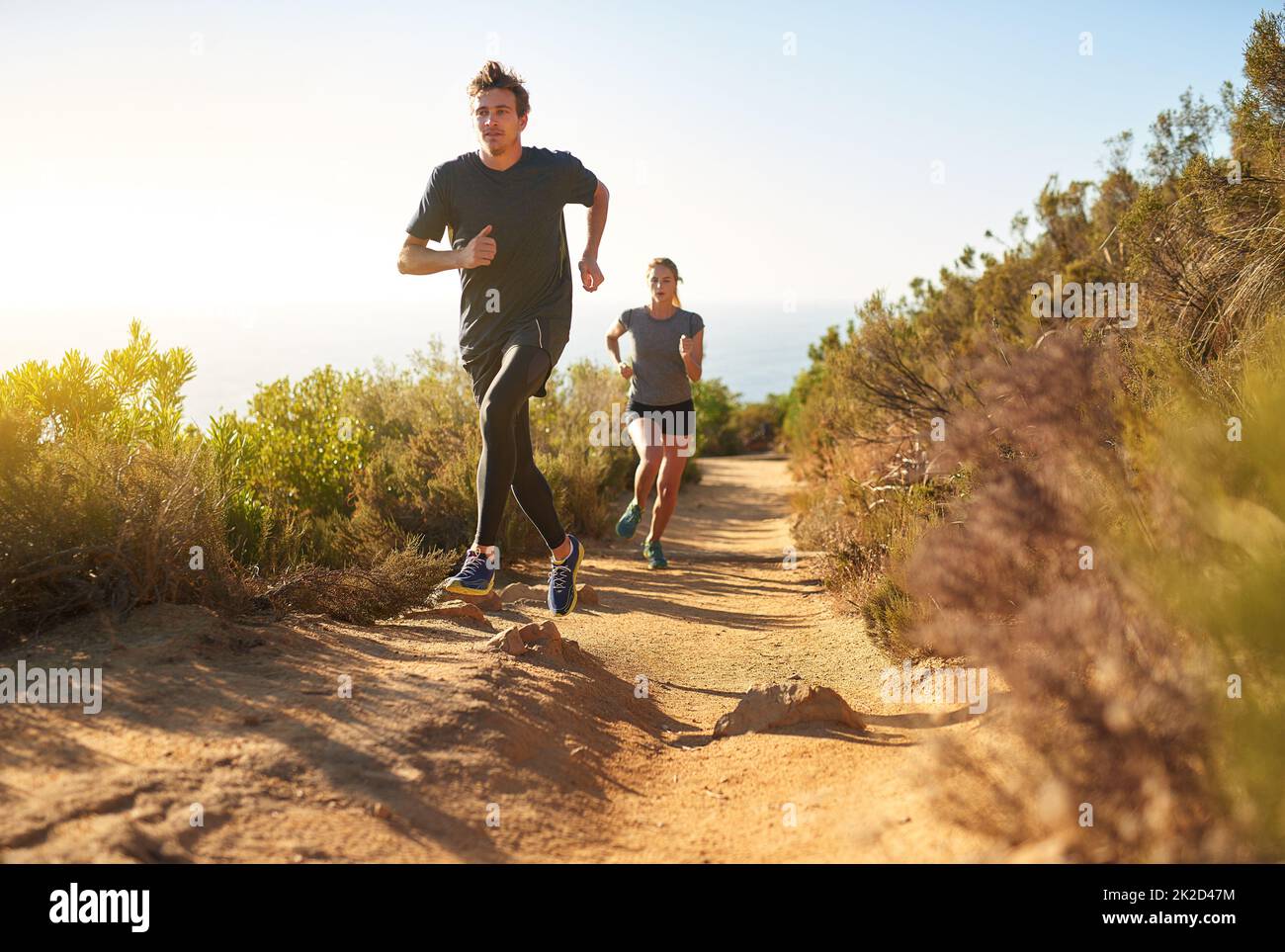 Taking the scenic route to fitness. Shot of a young couple out for a ...