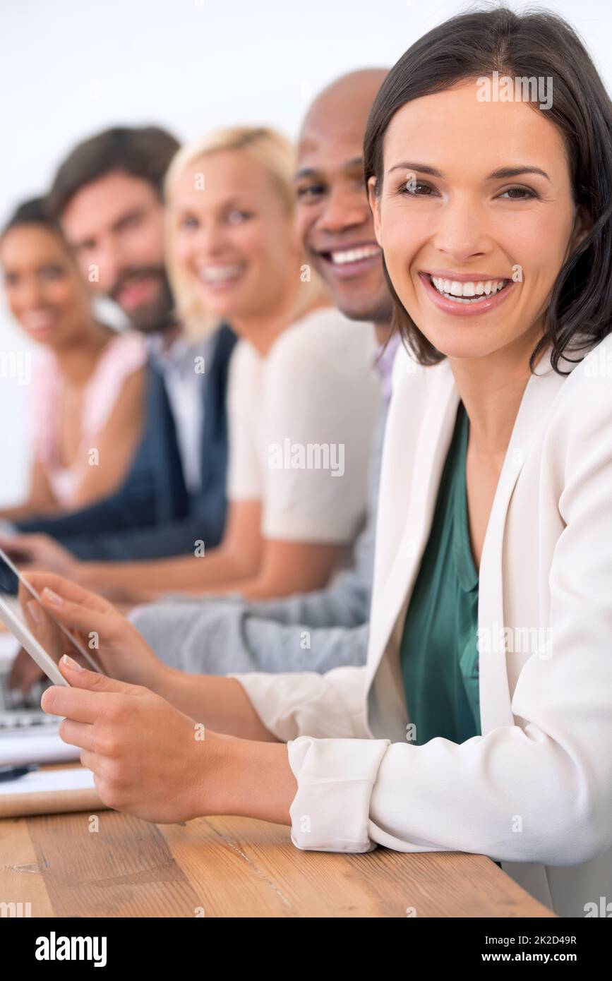 Big smiles in this office. Portrait of a diverse group of work colleagues Stock Photo - Alamy
