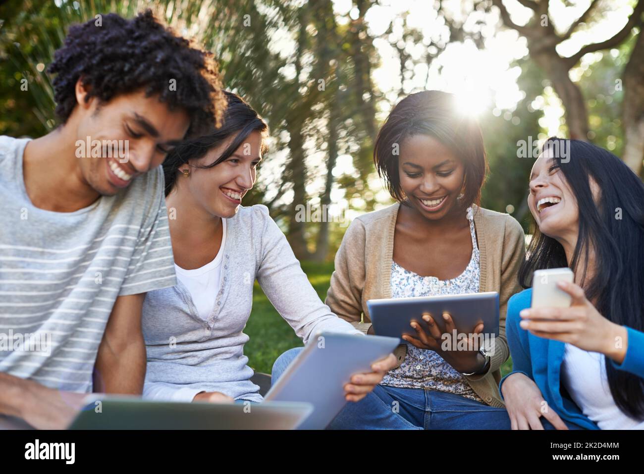 College diversity. Shot of a diverse group of college students sitting ...