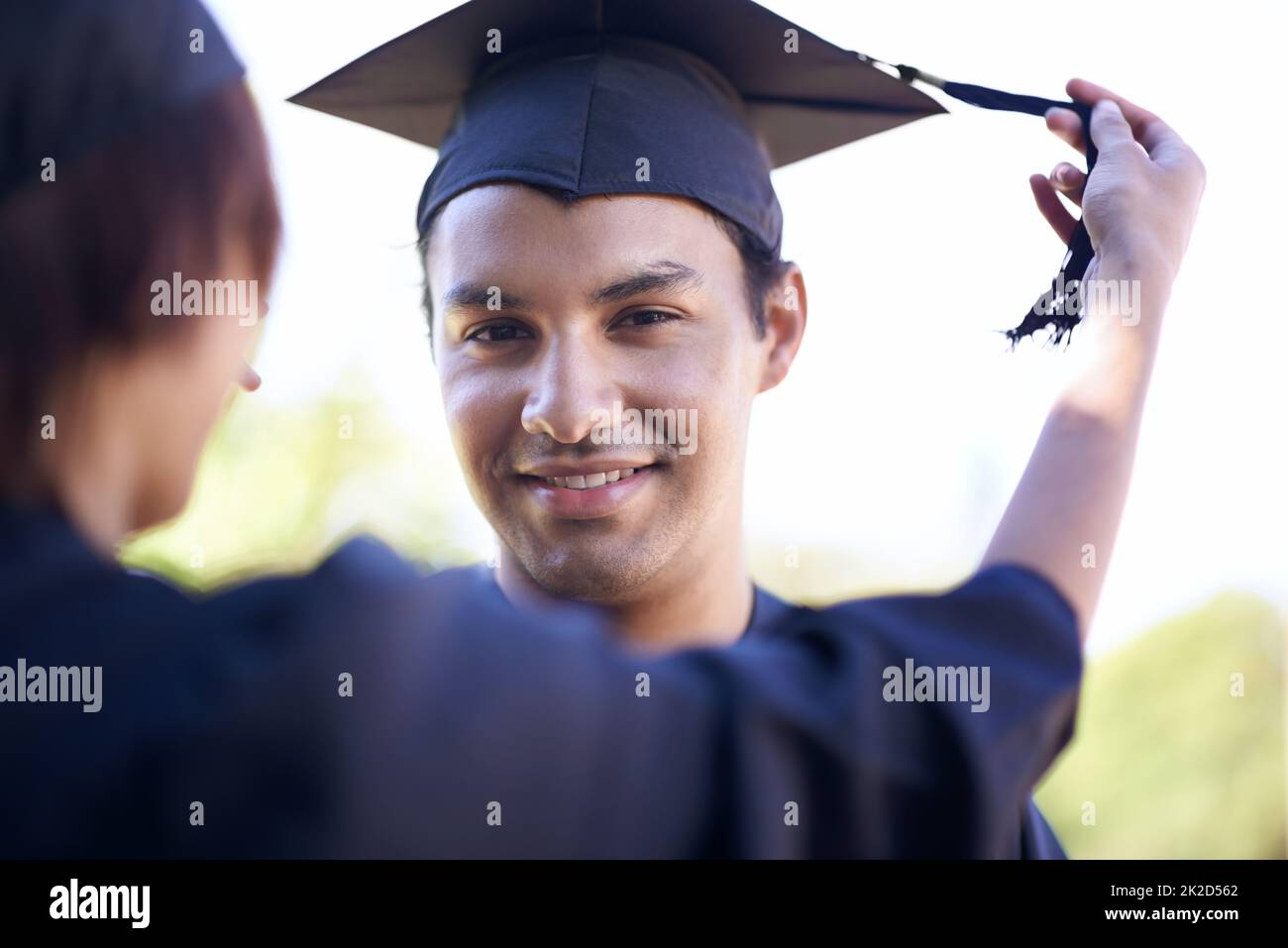 The day has come. A smiling graduate with his graduation hat on Stock ...