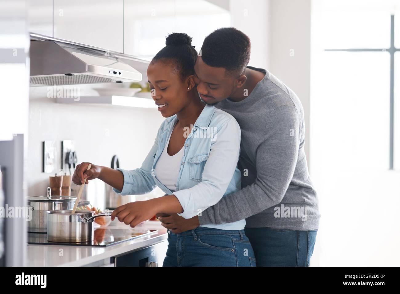 The Best Meals Are The Ones Made With Love Shot Of A Man Embracing His Wife From Behind While