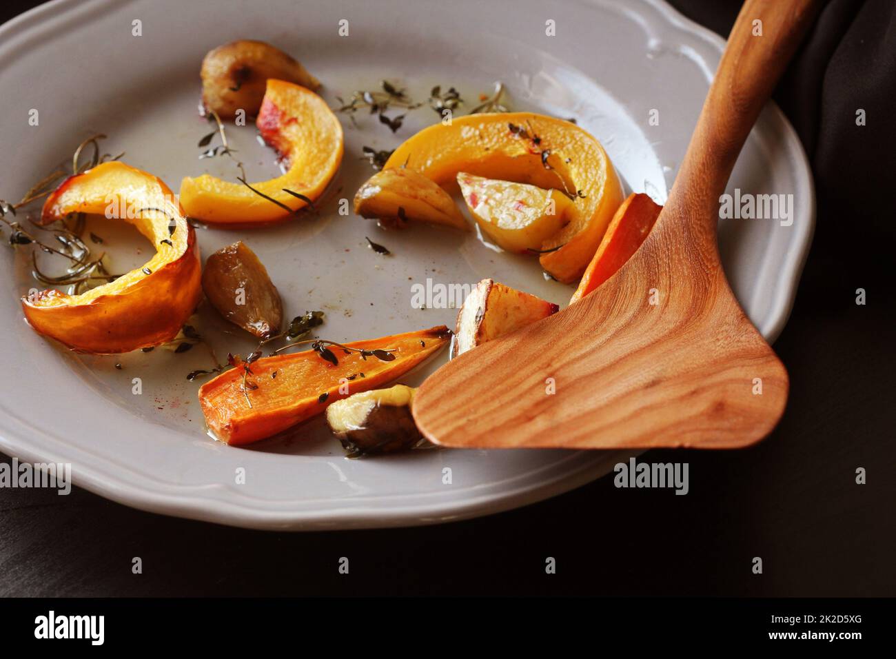 Grilled fall seasonal vegetables on plate over a dark background Stock ...