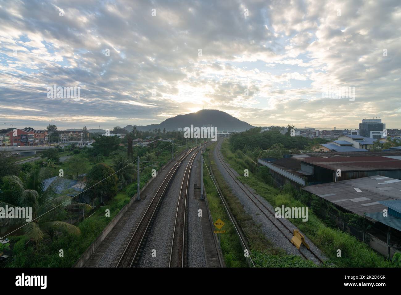 A railway path leading line to station Stock Photo - Alamy