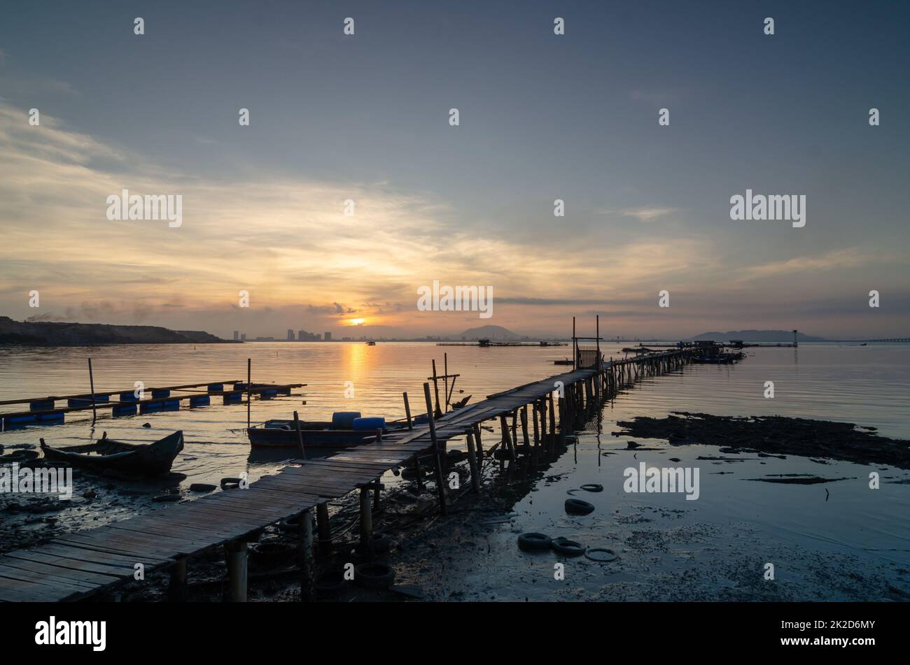 Wooden fisherman bridge in sunrise Stock Photo - Alamy