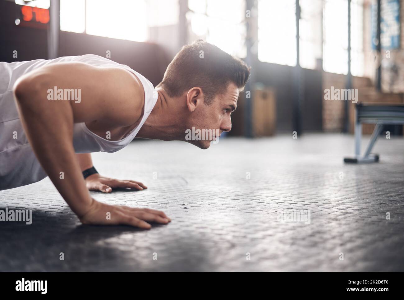 You were built to be the best. Shot of a young man doing pushups in a ...
