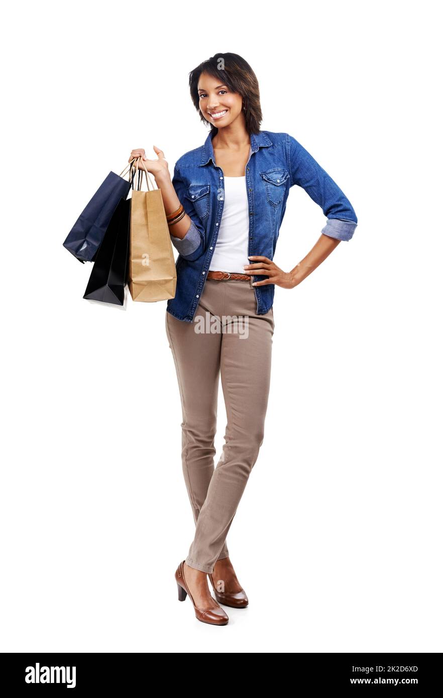 She just hit the mall. Full length studio portrait of a young woman ...