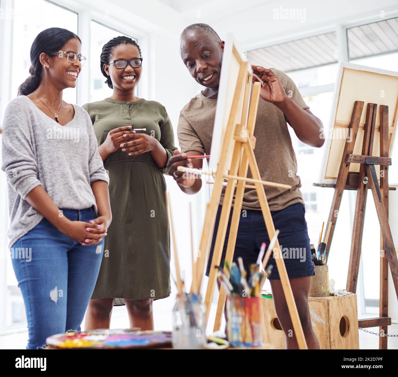 Our friends recommended this art class. Shot of a group of people ...
