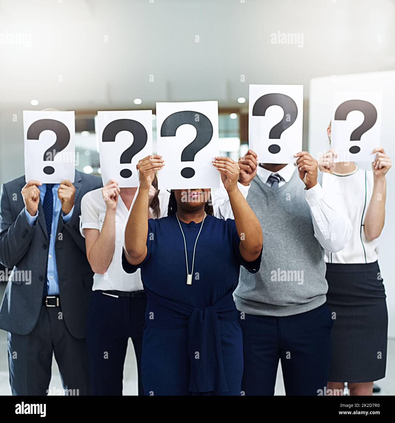 Business team holding question marks hi-res stock photography and ...