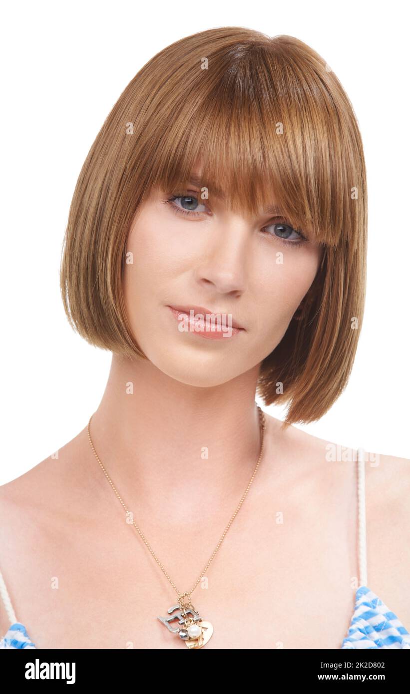 Giving you a serene look. A beautiful young woman looking calm against ...