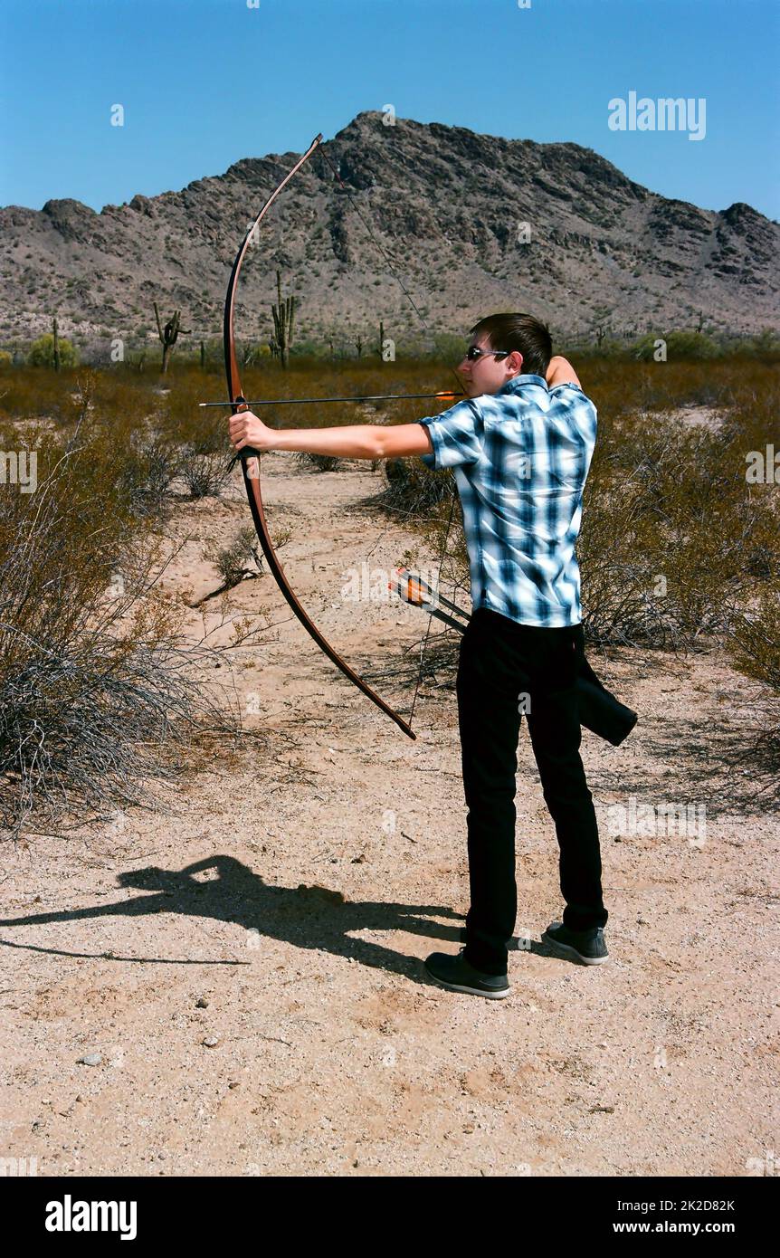 Child shooting arrow hi-res stock photography and images - Alamy