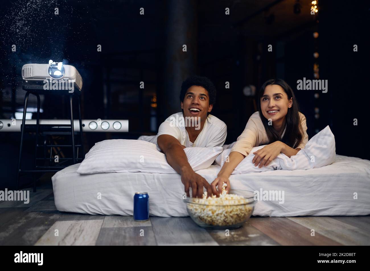 Young woman watching film on hi-res stock photography and images - Alamy