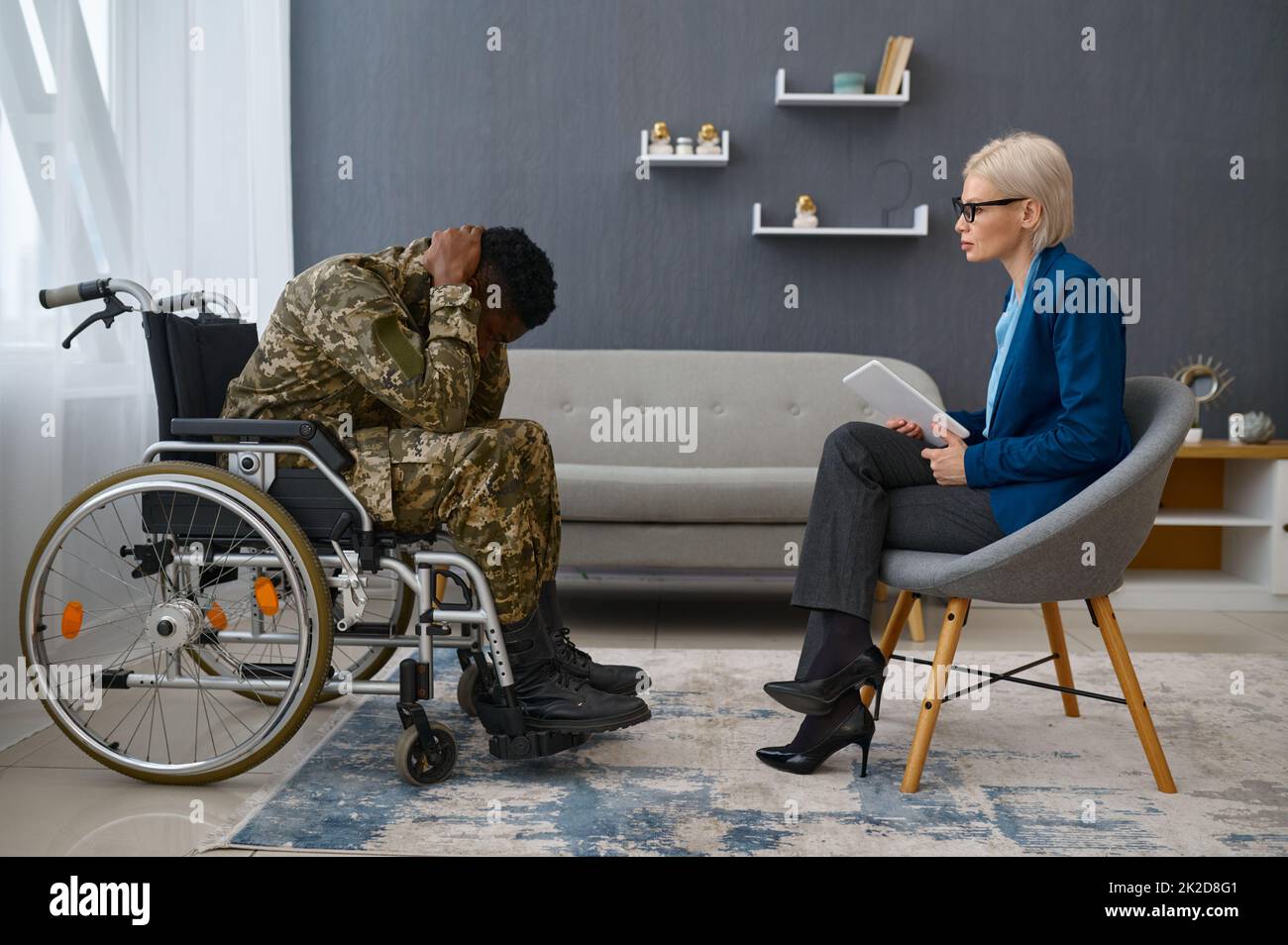 Soldier in camouflage holding head in hands Stock Photo - Alamy