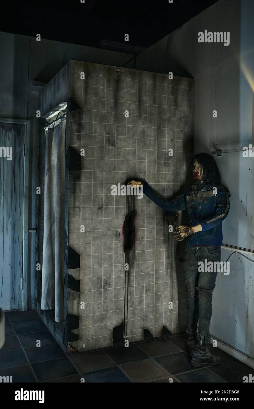 Bloodstained spooky zombie standing behind shower cabin Stock Photo - Alamy