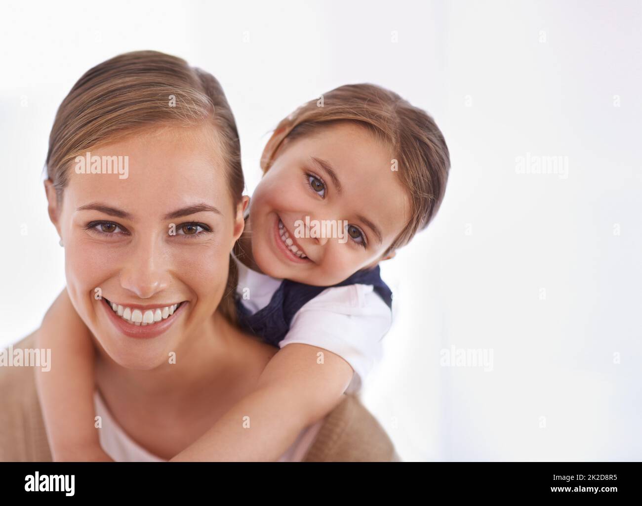 Sweet moments. Closeup portrait of a young mother and her little girl bonding at home Stock ...