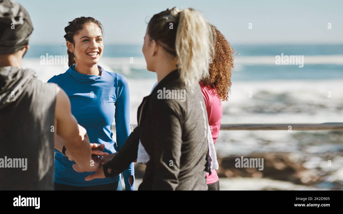 Discussing their exercise routine. Cropped shot of a fitness group ...