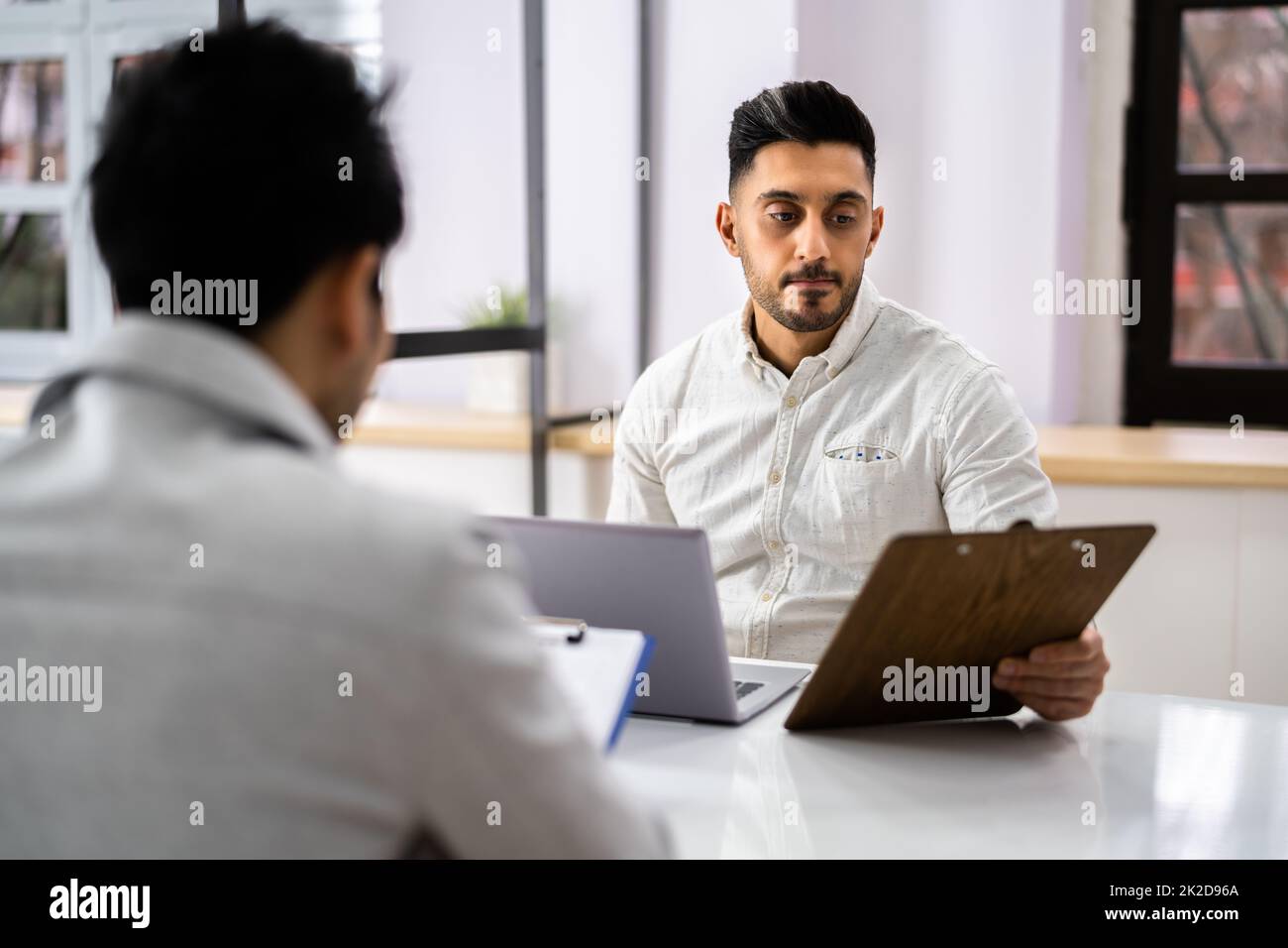 Businessman Conducting An Employment Interview Stock Photo - Alamy