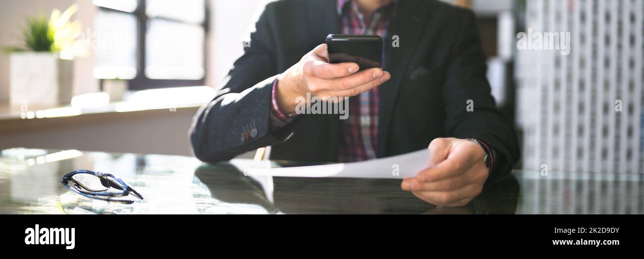 Remote Cheque Deposit Using Mobile Phone Stock Photo - Alamy